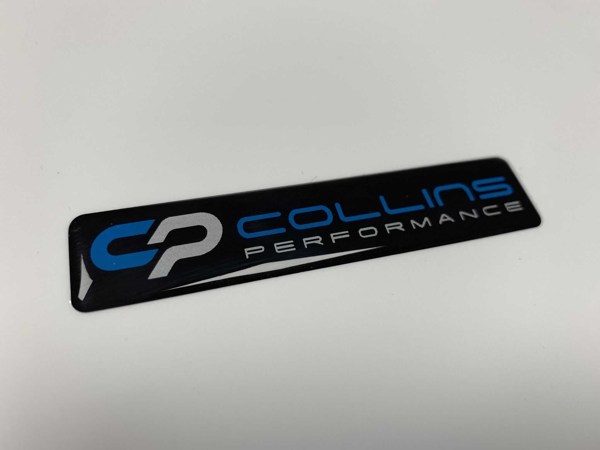 Collins Performance - Domed badge - 82x17mm / DMB Graphics Ltd